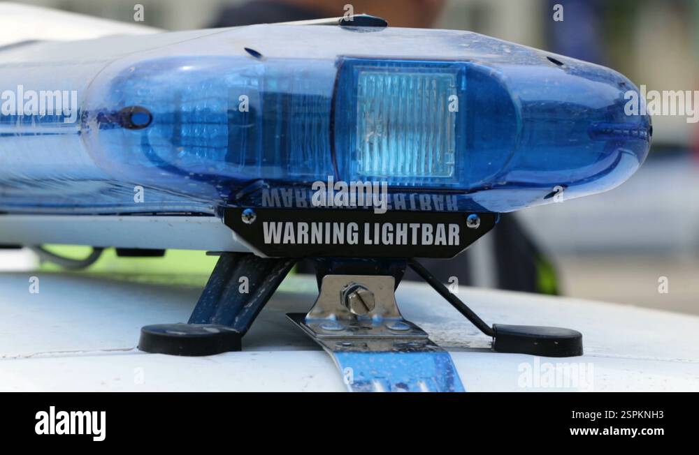 Police officers cars warning lightbars Stock Video Footage - Alamy