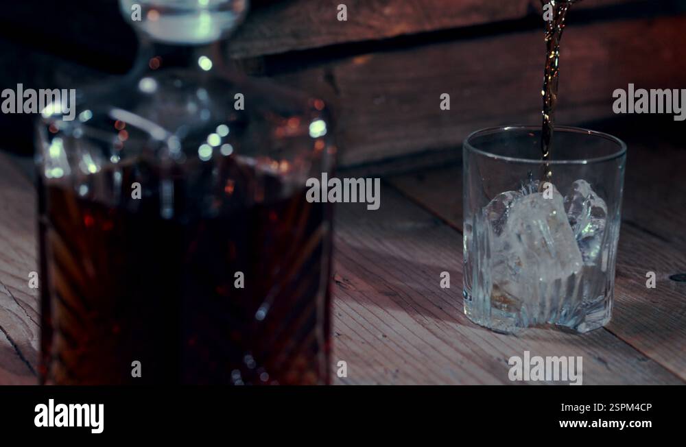 Ice dropped into glass of brandy slow motion shot on Phantom Flex 4K Stock Video Footage - Alamy