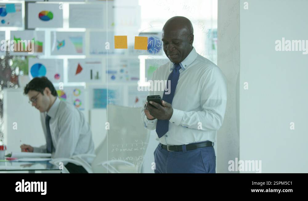 Office staff worker on cell phone in office Stock Video Footage - Alamy
