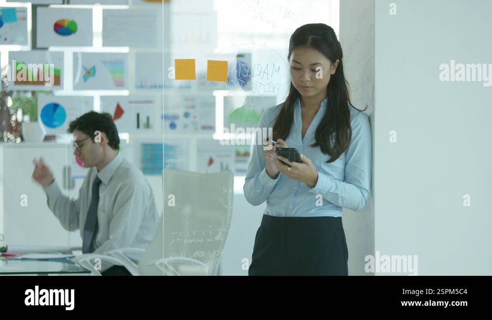 Office staff worker on cell phone in office Stock Video Footage - Alamy