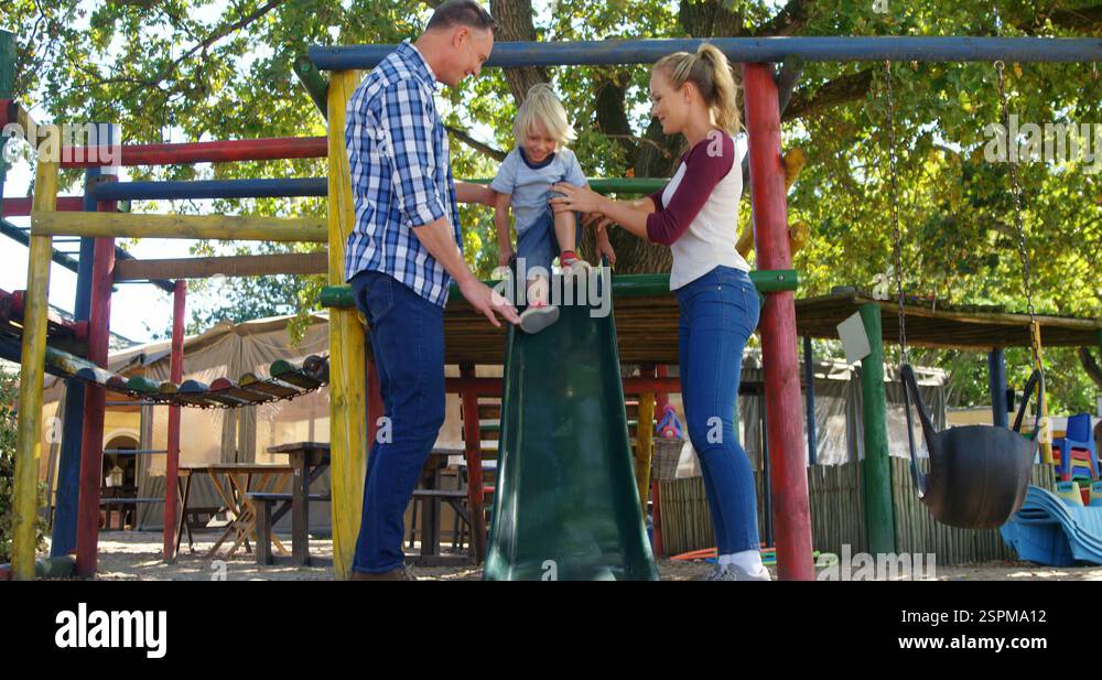 Family playing in the playground 4k Stock Video Footage - Alamy