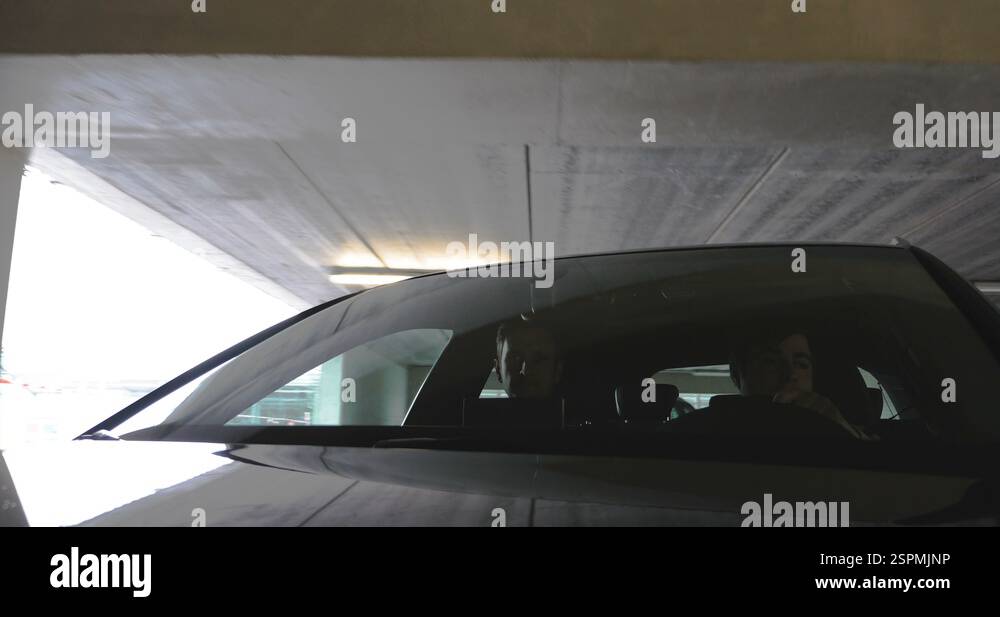 Passenger and Driver Through the Windshield Window of a Car Moving 2 ...