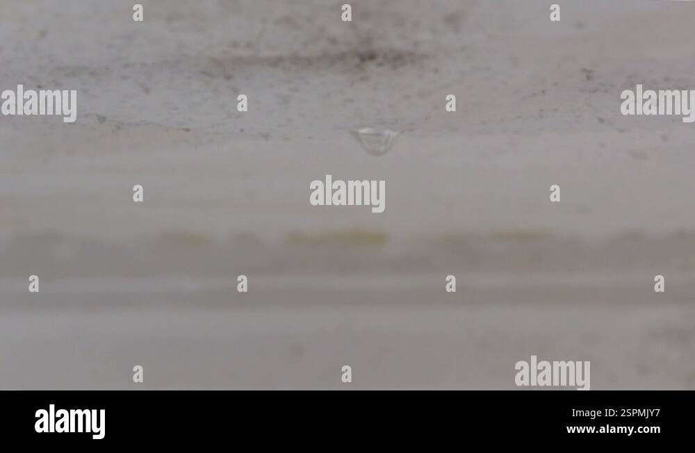 Water dripping from a leak and damage to a home's roof Stock Video ...