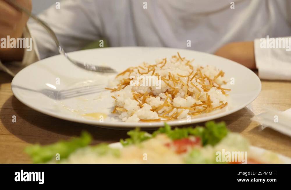 the child is eating Curry rice with pork cutlet. 4k Stock Video Footage ...