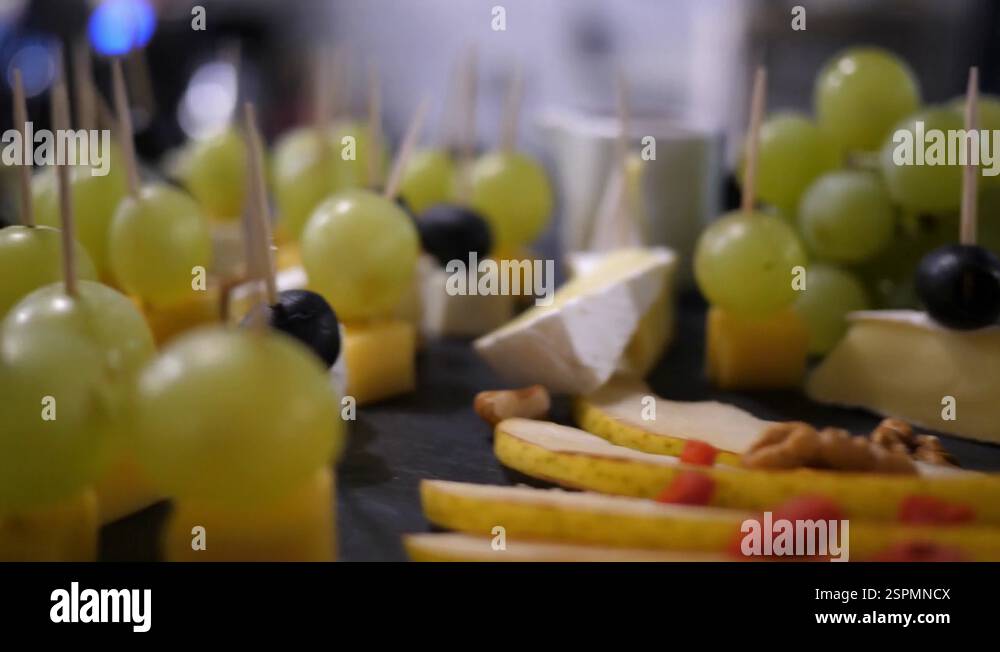 Catering food layout fruit and cheese snacks are laid out on the table ...
