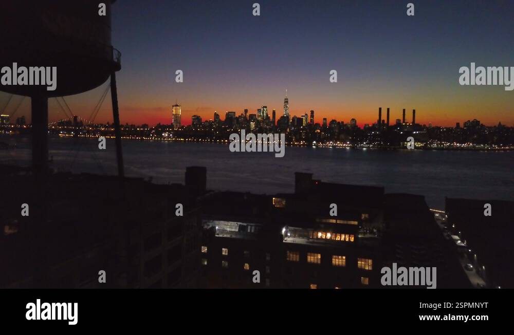dusk view of Manhattan skyline flying bkwd reveals Greenpoint Bkln ...