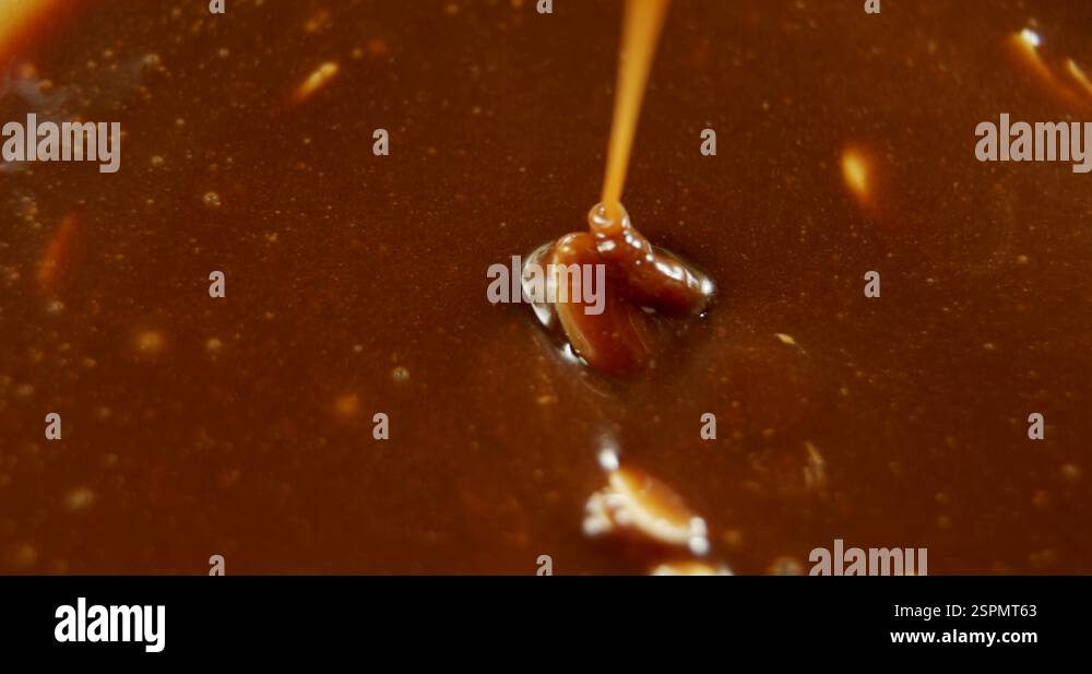 Caramel being mixed in melted chocolate 4k Stock Video Footage - Alamy