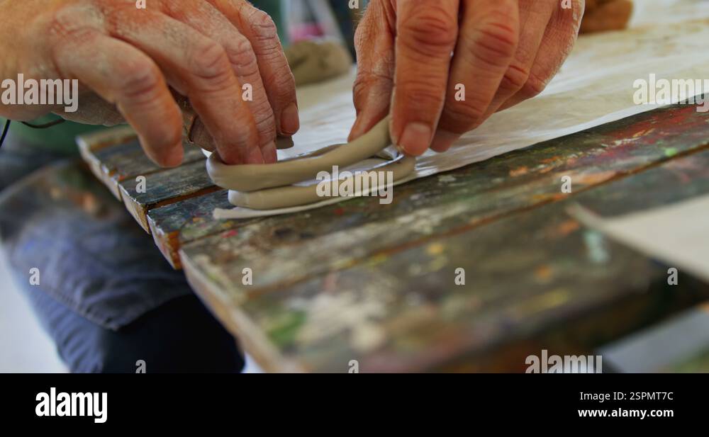 Mid section of artist molding clay at table 4k Stock Video Footage - Alamy
