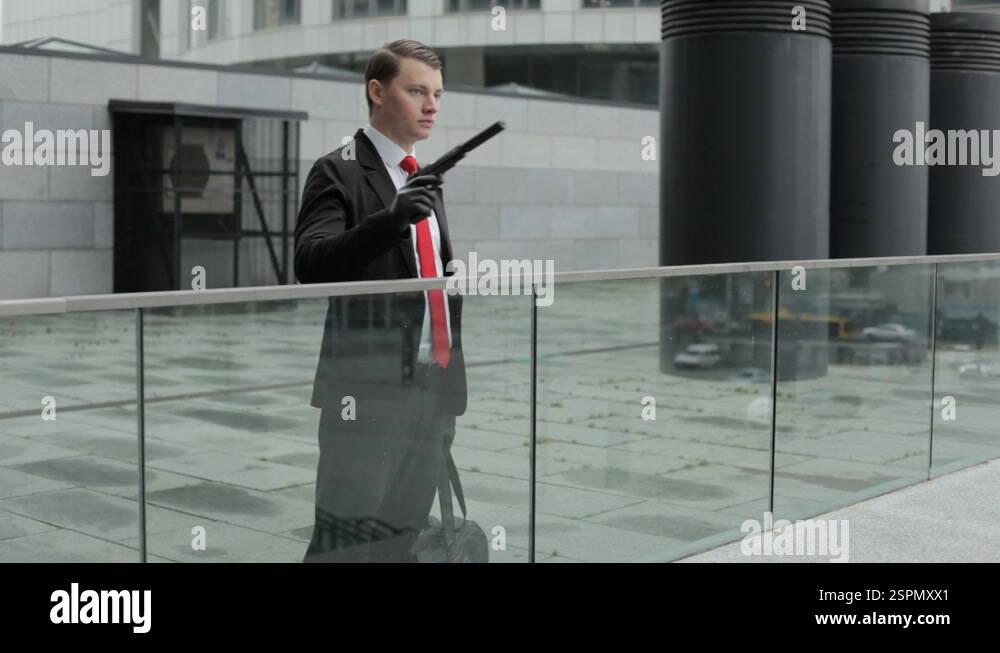 Mafiosi with a pistol passes the bag Stock Video Footage - Alamy