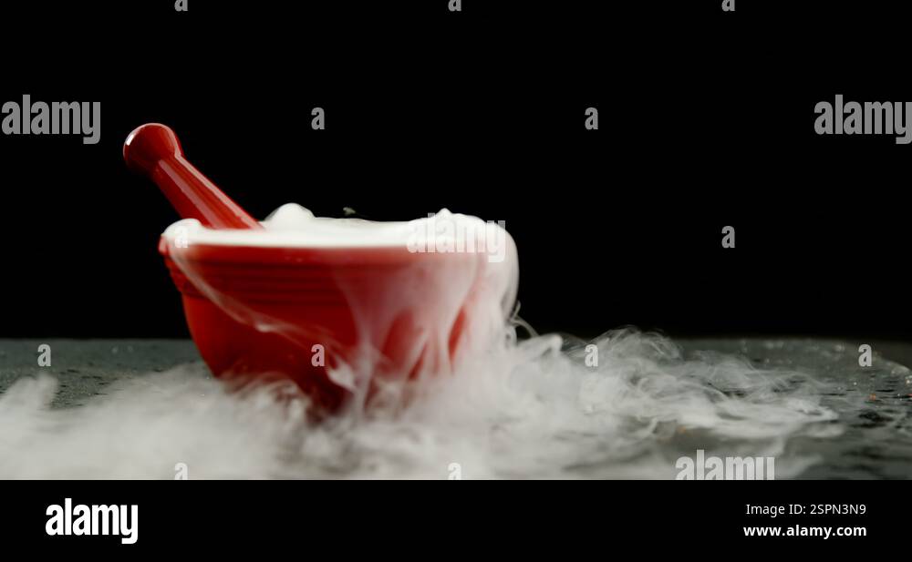 Ice smoke in mortar and pestle against black background 4k Stock Video ...