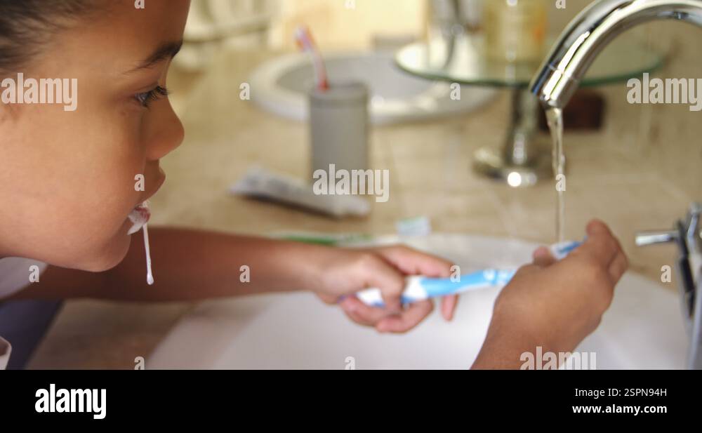 Girl brushing her teeth in bathroom 4k Stock Video Footage - Alamy