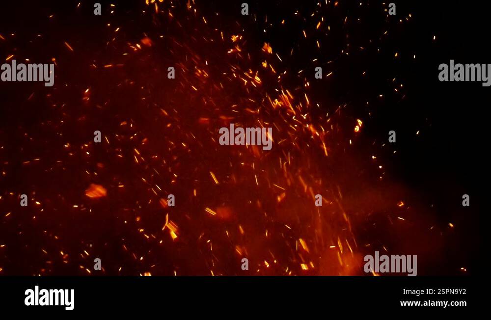 Bonfire sparks and embers floating up into night sky Stock Video ...