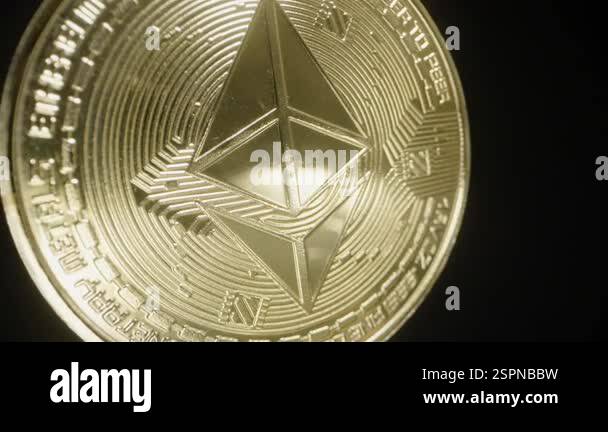 Ethereum Coin Rotating with Golden Light Reflecting Brilliantly Across ...