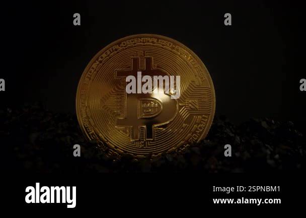 A Hand Replacing a Bitcoin Coin with an Ethereum Coin on Dark Rocks ...