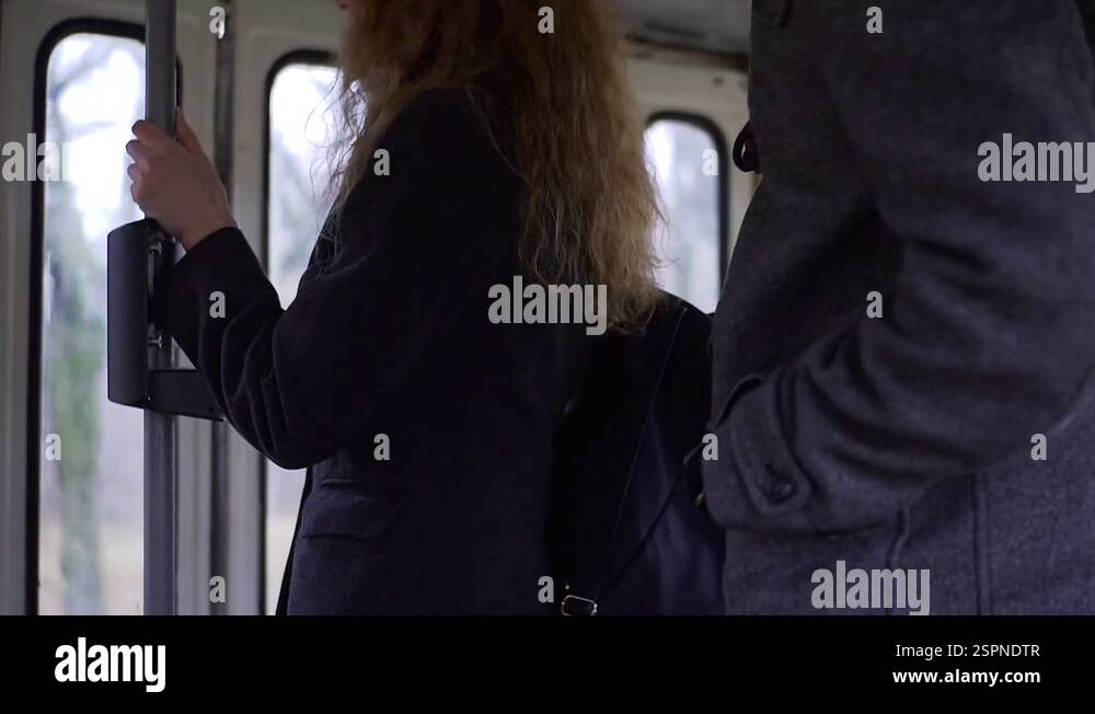 Pickpocket stealing phone from a woman's pocket in tram or bus Stock ...