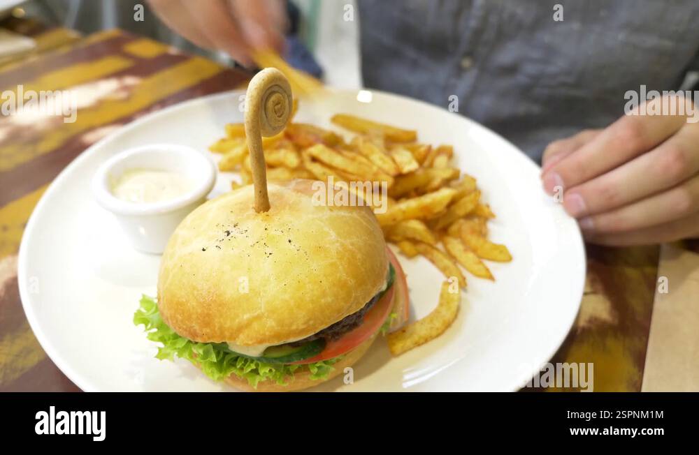 man eating a hamburger. close-up. cutlet sandwich. 4k Stock Video ...