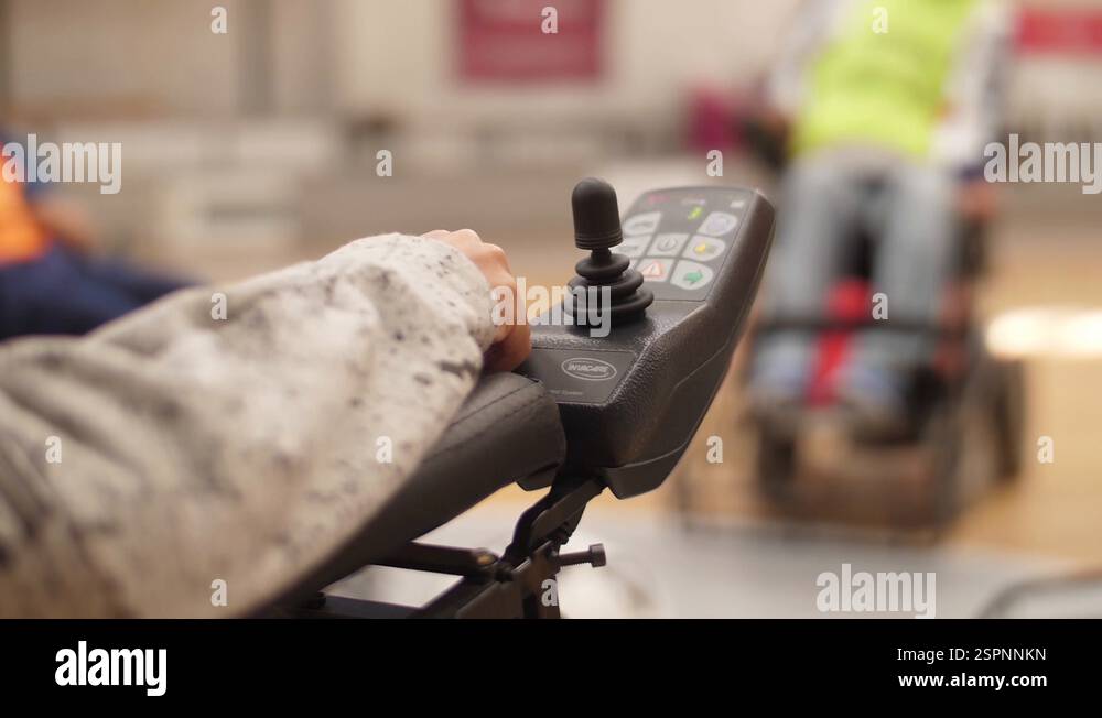 disabled man safely drives a power wheelchair using joystick slow ...