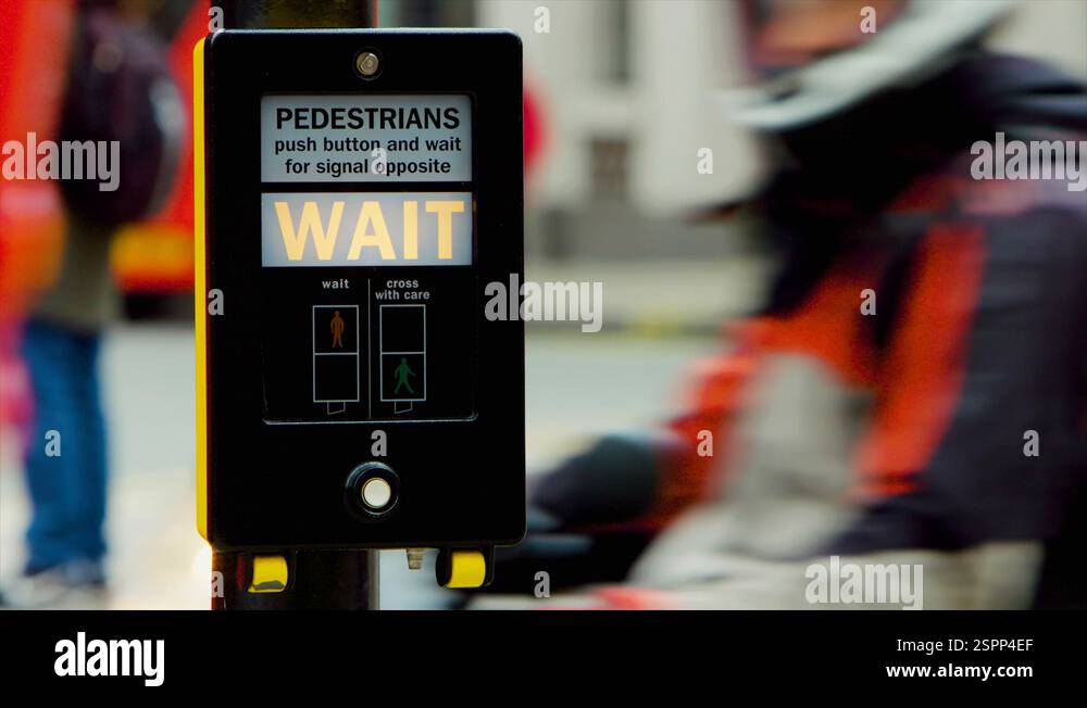 Walk or wait sign next to a crosswalk in London, UK. Warning signal ...