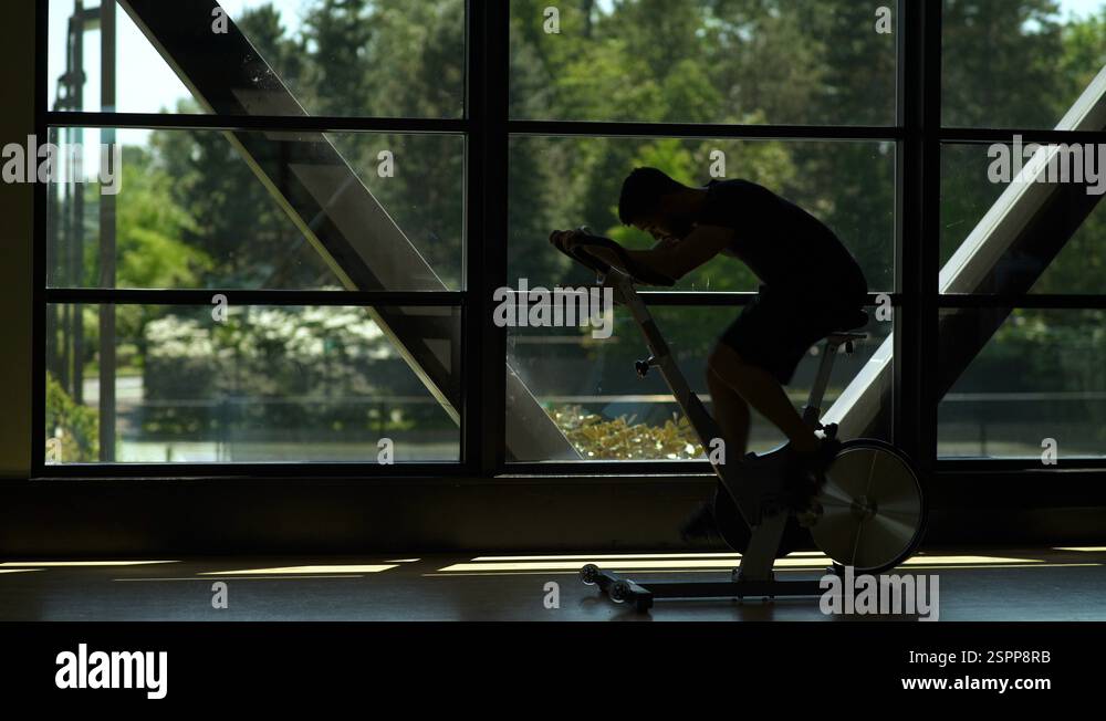 Young man spinning in a gym by himself Stock Video Footage - Alamy