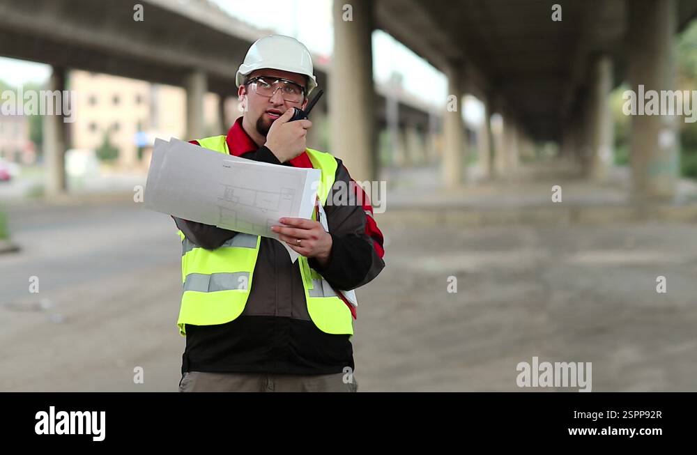 Road fettler with design drawings under overpass Stock Video Footage ...