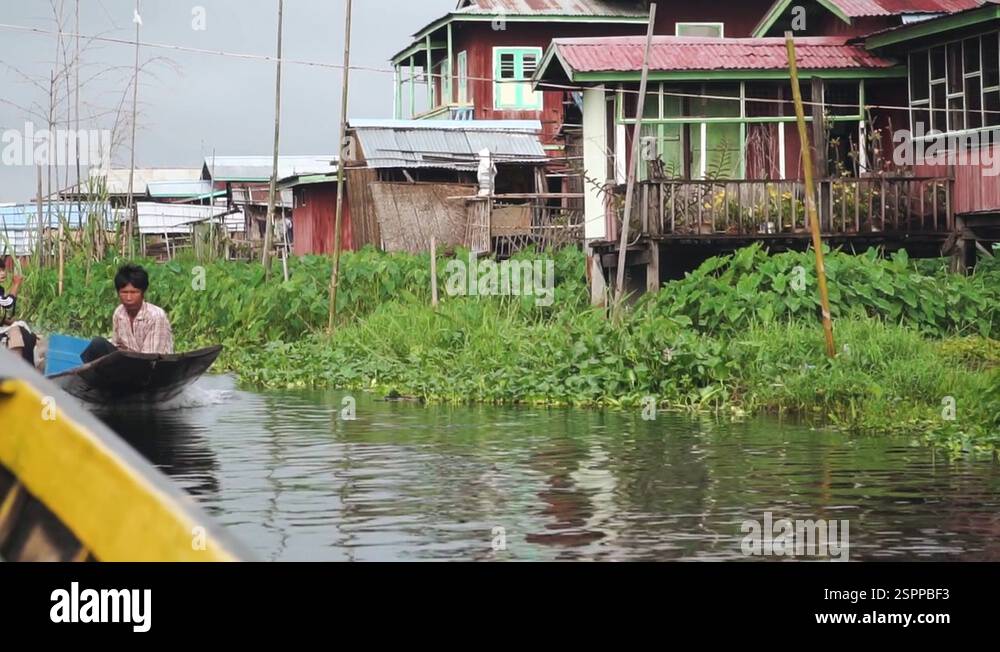 Burmese Locals Riding Boat Among Floating Village at Inle Lake, Myanmar ...