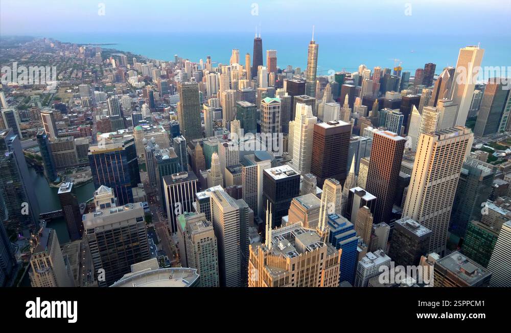 Aerial View of Chicago City Skyline and Lake Michigan (logos blurred ...