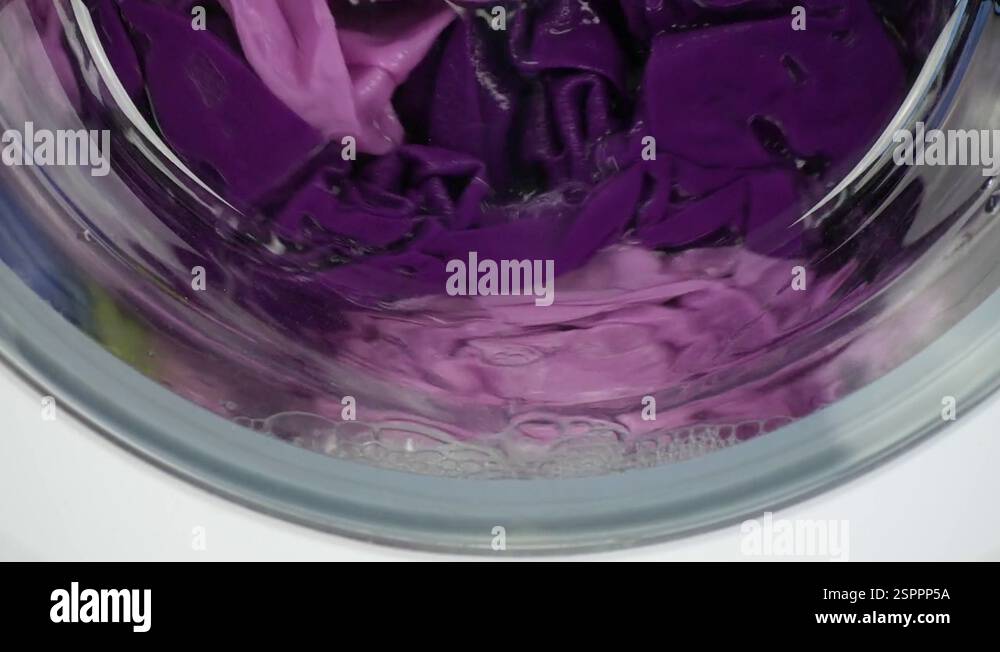 Extreme Close Washing Machine Door View with Wet Clothes and Water ...