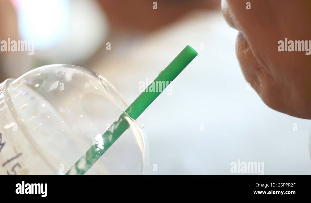 Women are drinking water with a tube. To get tired from work and back ...