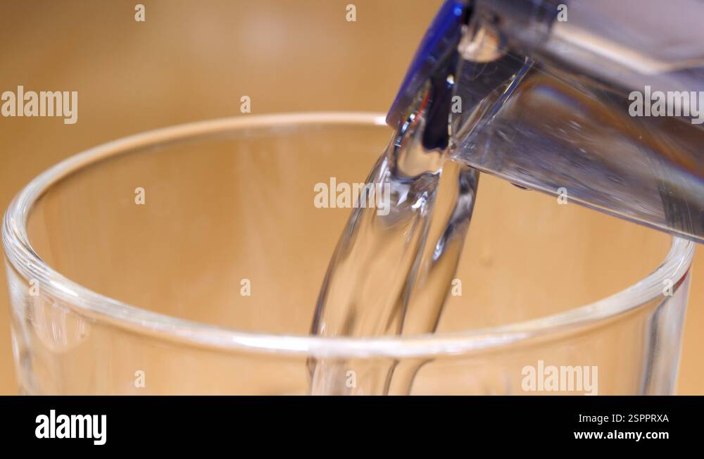 Close up of water pouring pitcher to glass Stock Video Footage - Alamy