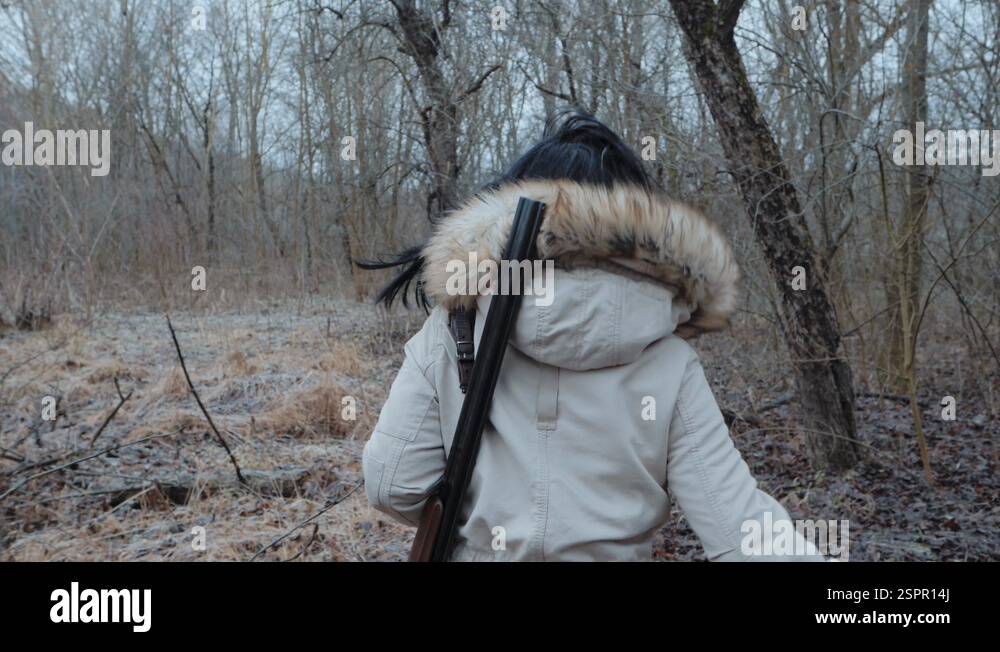 Hunter running with rifle in forest. unrecognizable girl training with ...