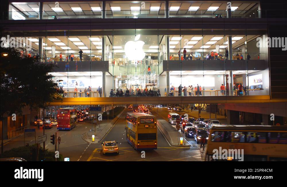 Apple store above the road with driving cars. Night. Hong Kong, China ...