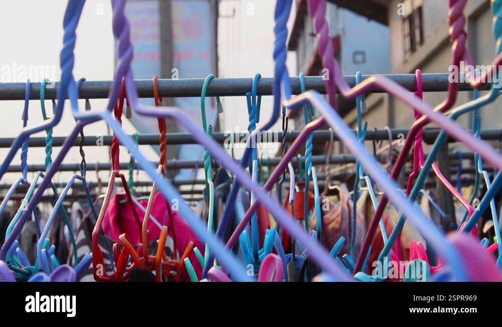 clothes hanger background Stock Video Footage - Alamy