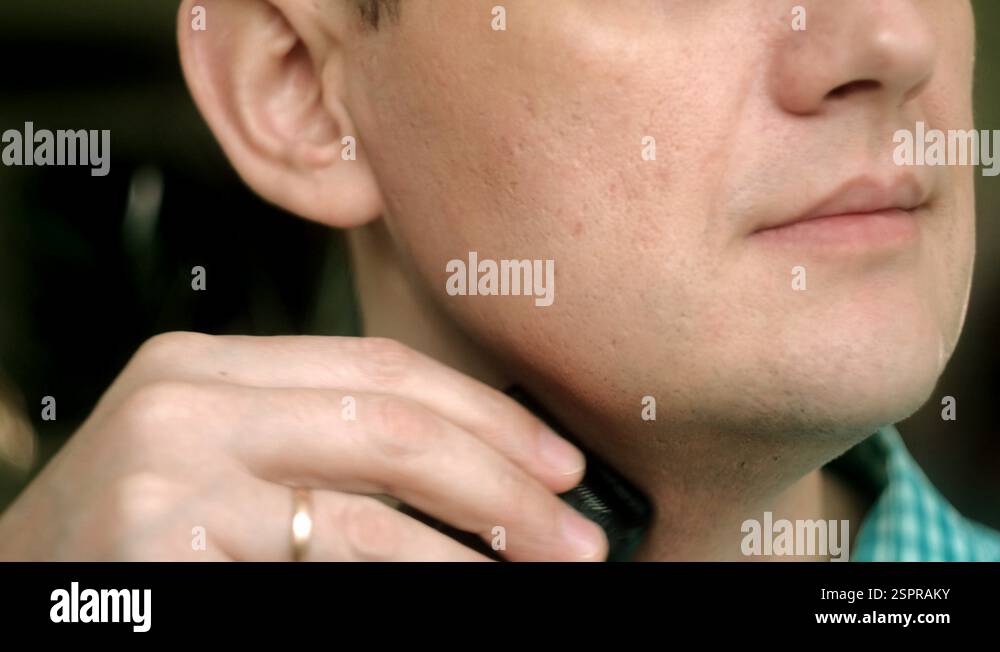 Man shaving beard with electric shaver. Check shaving swiping your ...