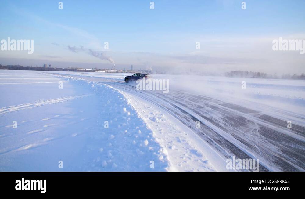 Sport car racing on snow race track in winter. Driving a race car on a ...