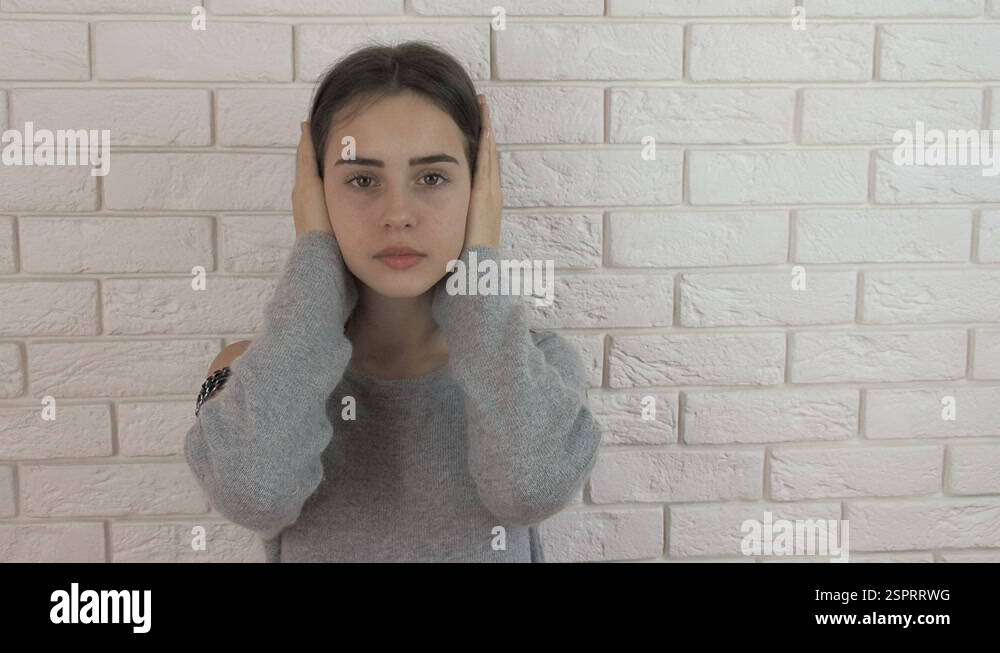 Sign Language. A beautiful girl closes her eyes, her mouth, her ears ...