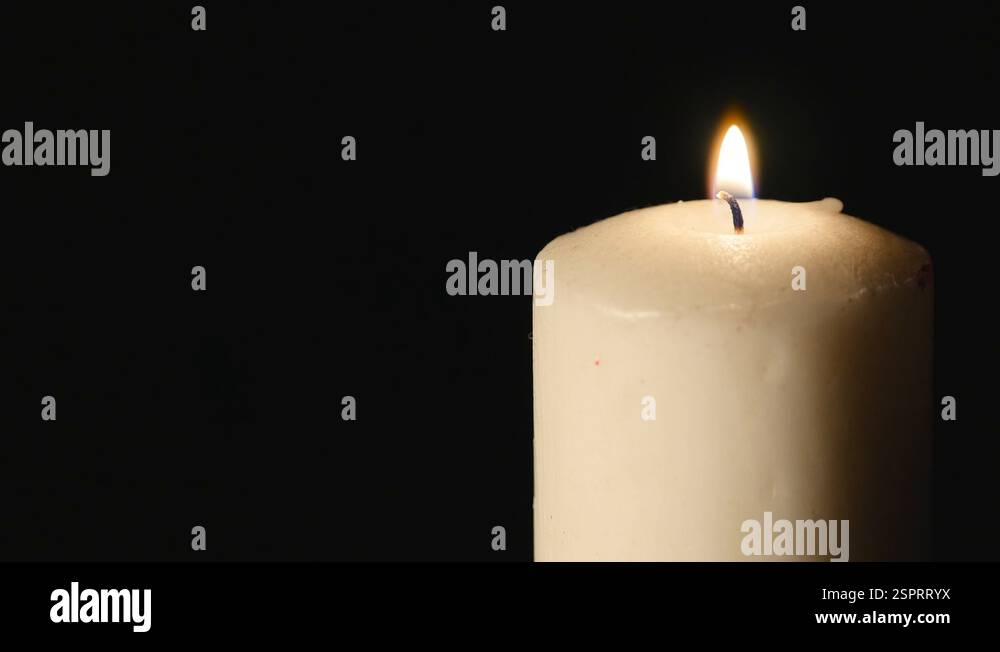 Candle blown out. The candle is lit and extinguished in the dark. White ...