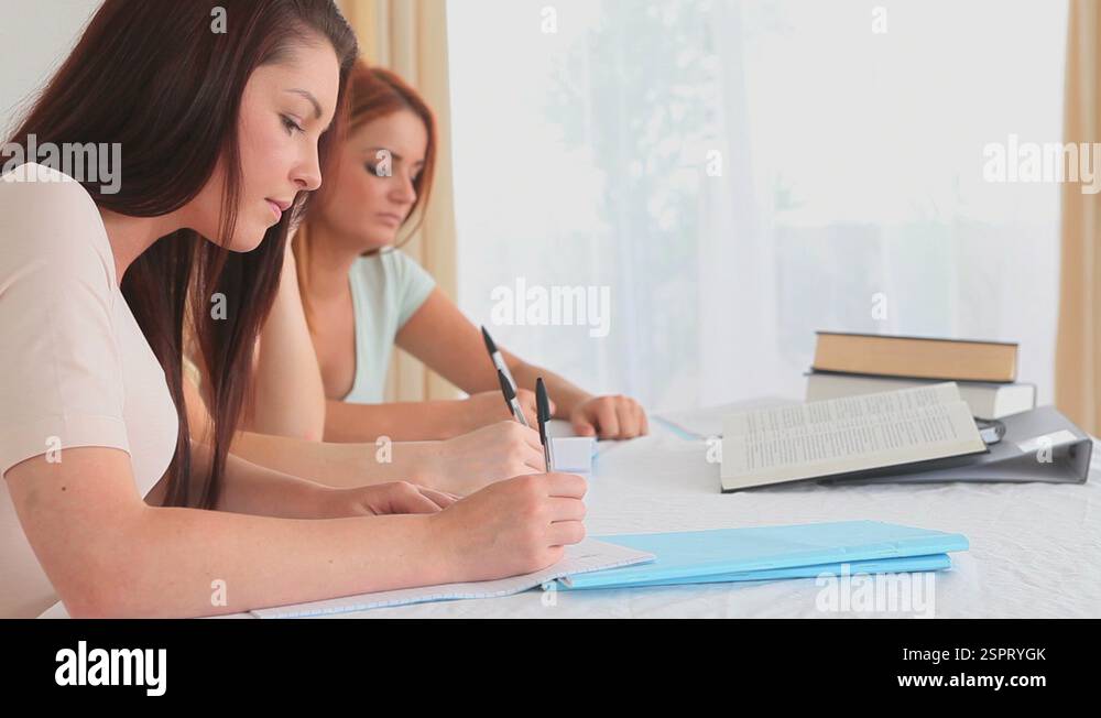 Young women learning together Stock Video Footage - Alamy