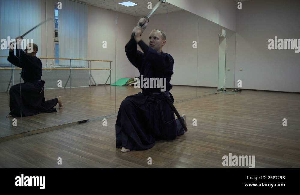 Master Kendo Conducts Training with the Catana Sword in Squat Performs ...