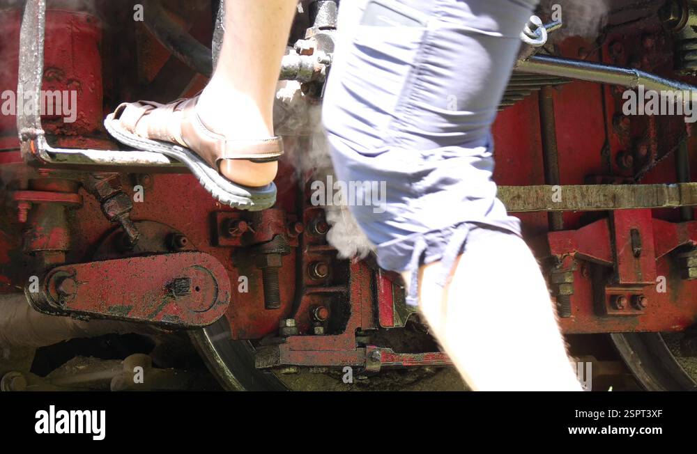 Mechanic Foot Climb into the Locomotive Cabin in a Train with Old Steam ...