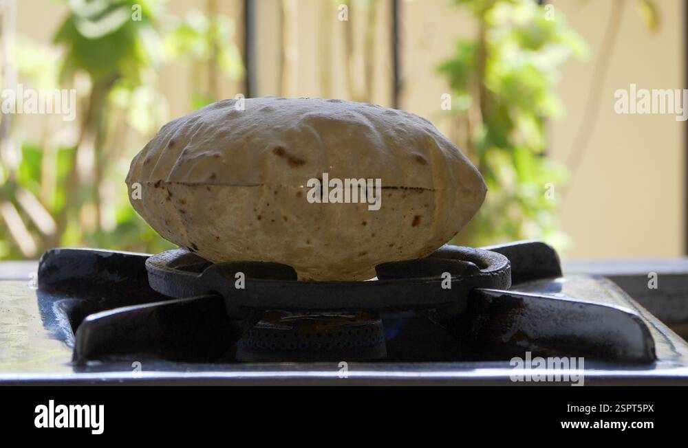 Making of Phulka a kind of Chapati: Indian thin bread made from wheat ...