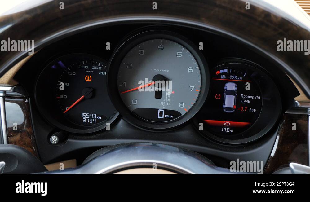 Moving arrow on tachometer in dashboard car while pressing on ...