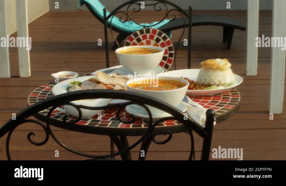dishes of Thai cuisine. 4k. table by the pool. Thai traditional lunch ...