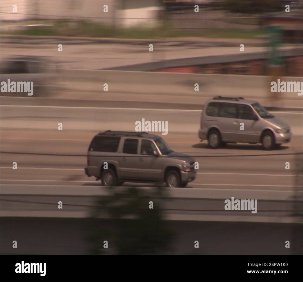Houston, TX; MS camera tracks gray SUV moving on highway ramp Stock ...