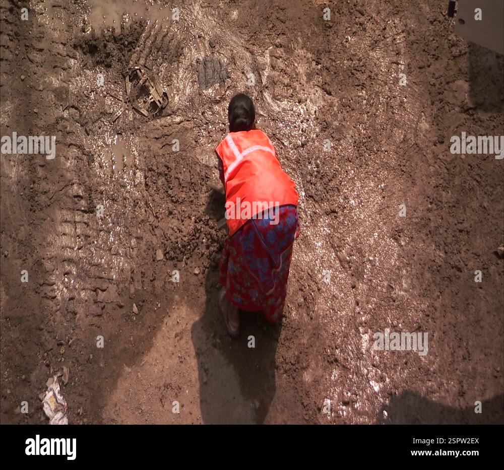 Female worker smoothing concrete at construction site Stock Video ...
