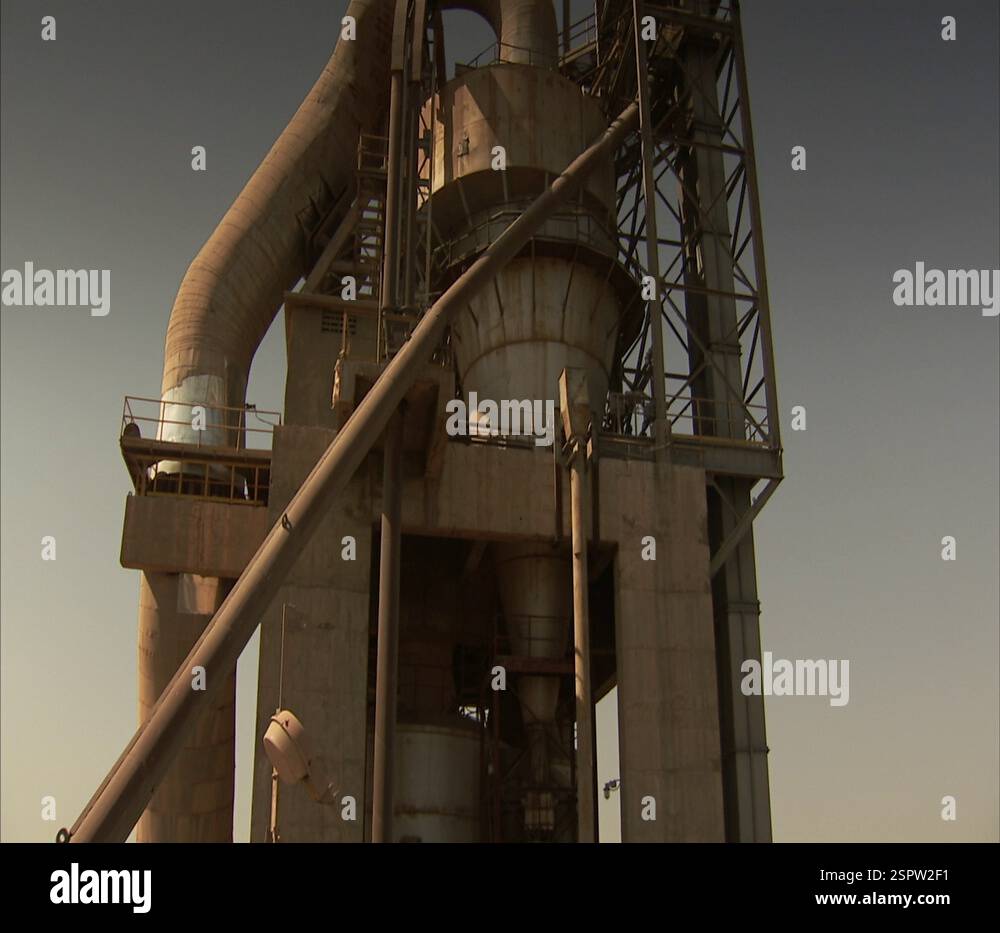 Pan from top of tower to high angle view of Vikram Cement works Stock Video Footage - Alamy
