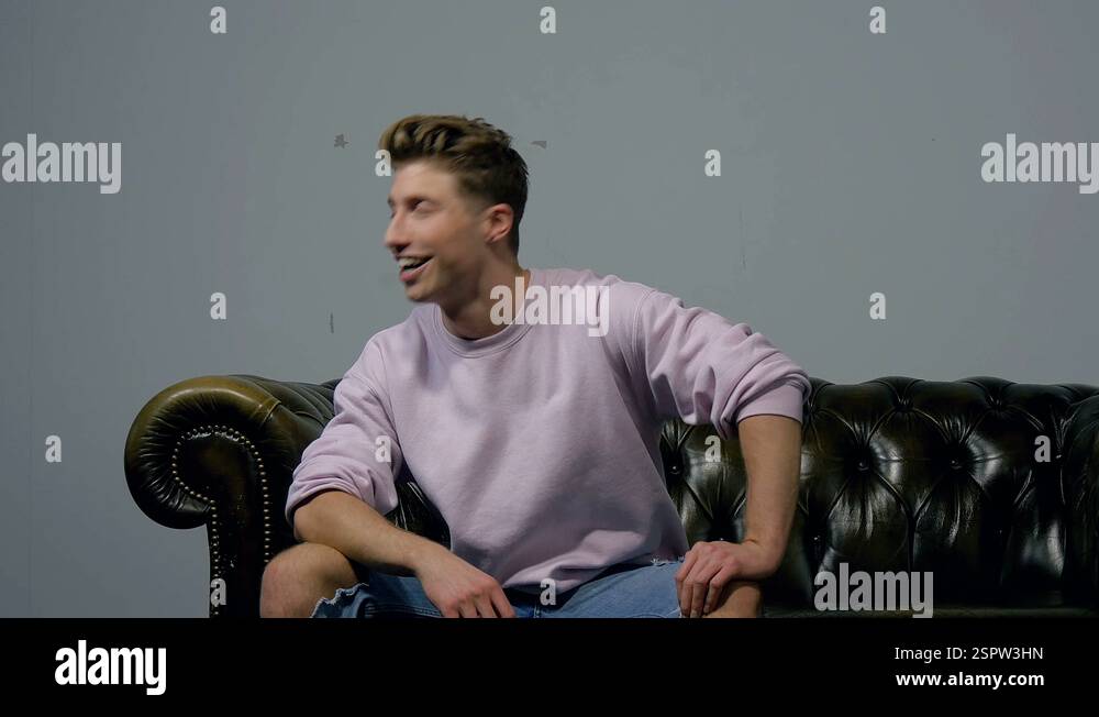 Handsome Male Actor Making Facial Expression Seated Leather Sofa Stock ...