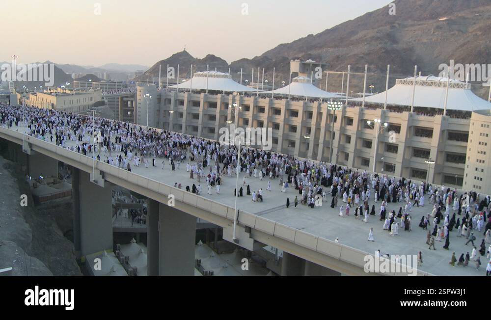 Hundreds of Hajj pilgrims walking up Jamaraat bridge in Mina, Saudi Arabia Stock Video Footage ...