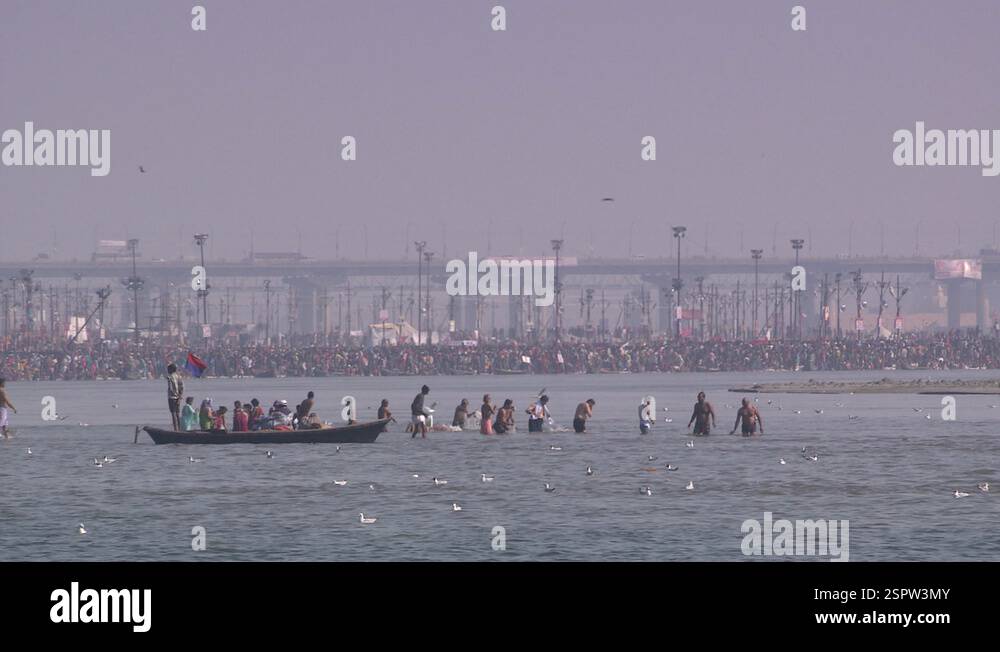 Kumbh Mela pilgrims in middle of Ganges River bathing, swimming Stock ...