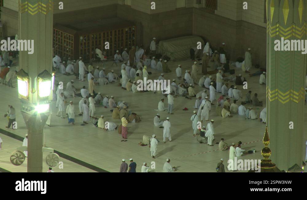 Muslim men gathering to pray outside of Prophet's Mosque in Medina ...