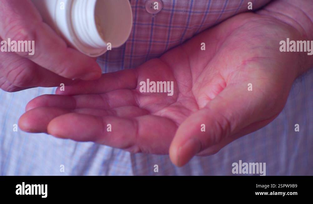 treatment with tablets.hand takes the tablets from the bottle into the palm Stock Video Footage ...